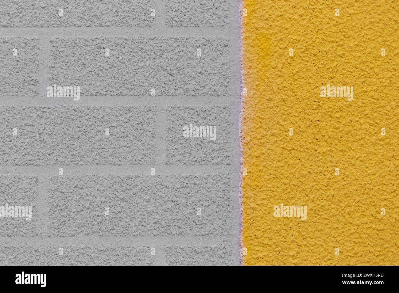 Rough wall brick abstract pattern two colors yellow bright grey plaster ...