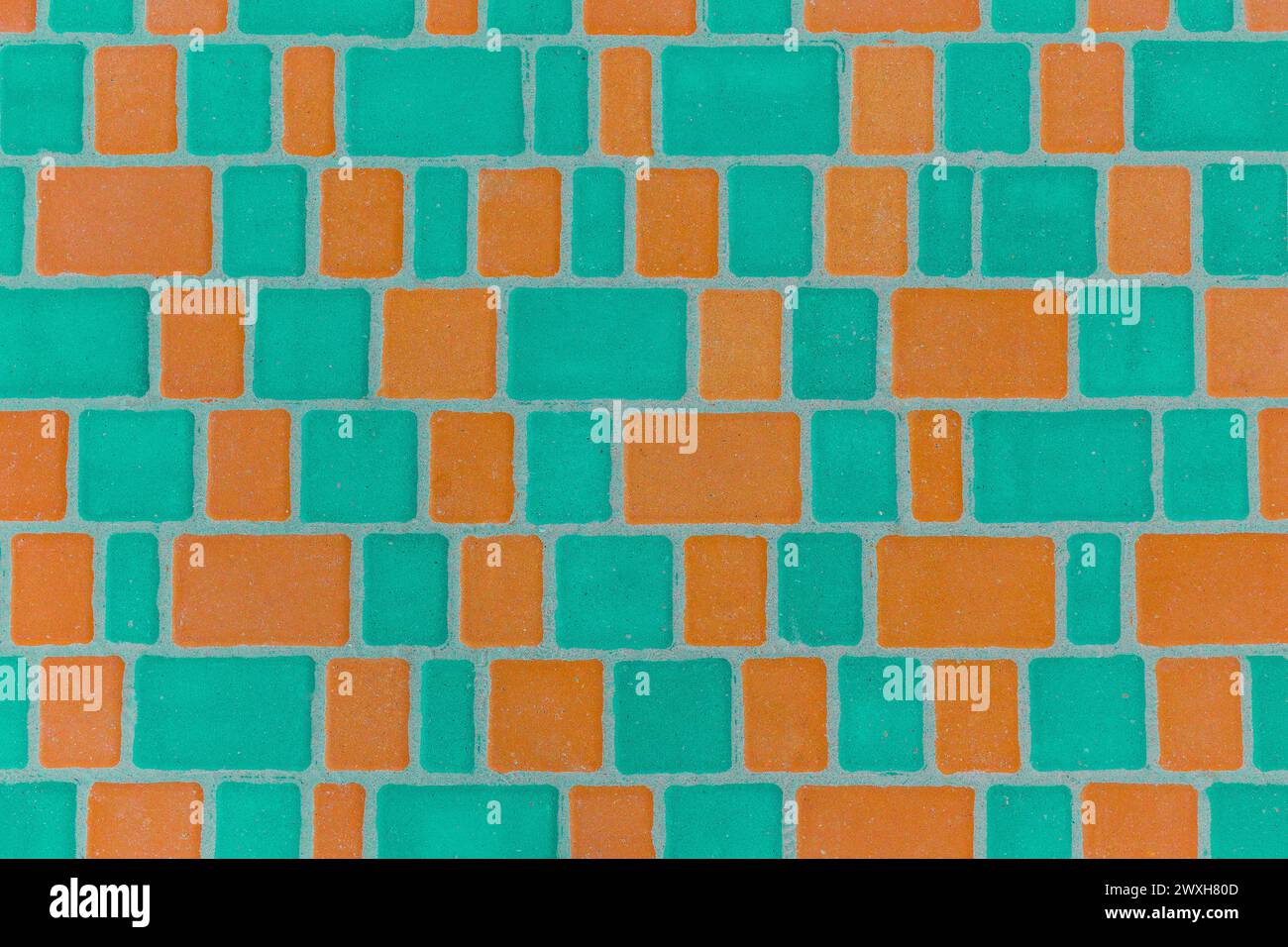 Top view of stone mosaic paving slabs color orange and aquamarine ...