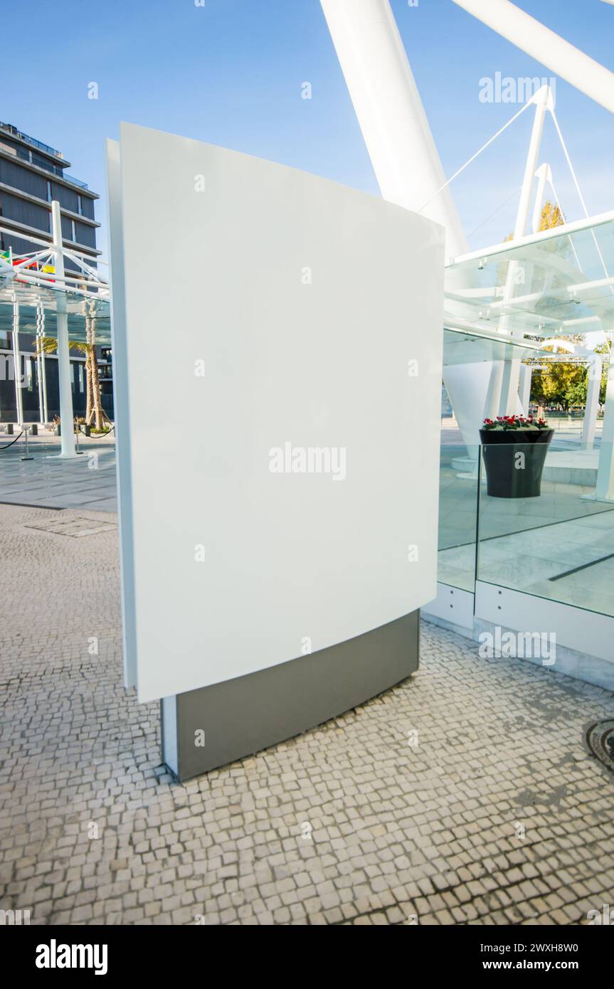 Large white blank screen on public walkway with sign Stock Photo - Alamy