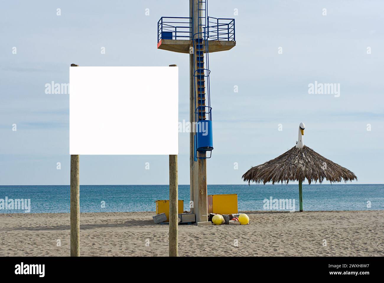 Deserted beach with a wooden ladder Stock Photo - Alamy