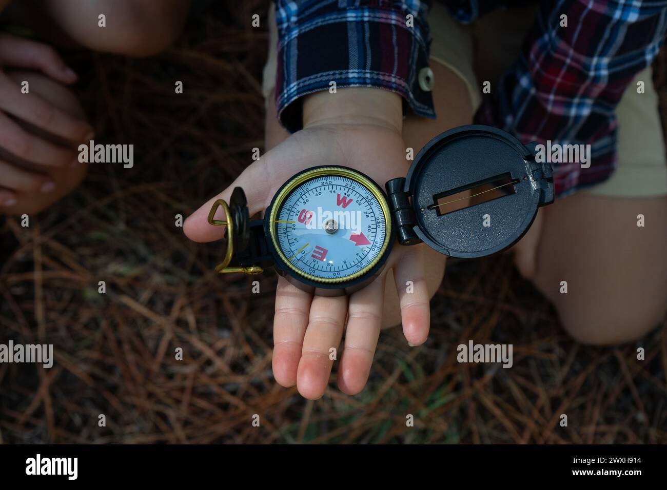 Childs hand with compass hi-res stock photography and images - Alamy