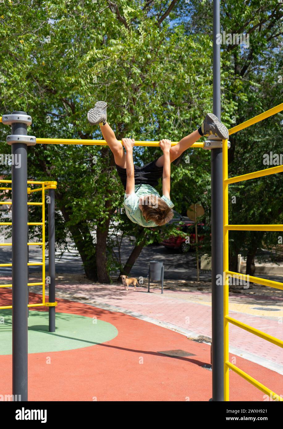 Boy doing stunts at an exercise park Stock Photo - Alamy
