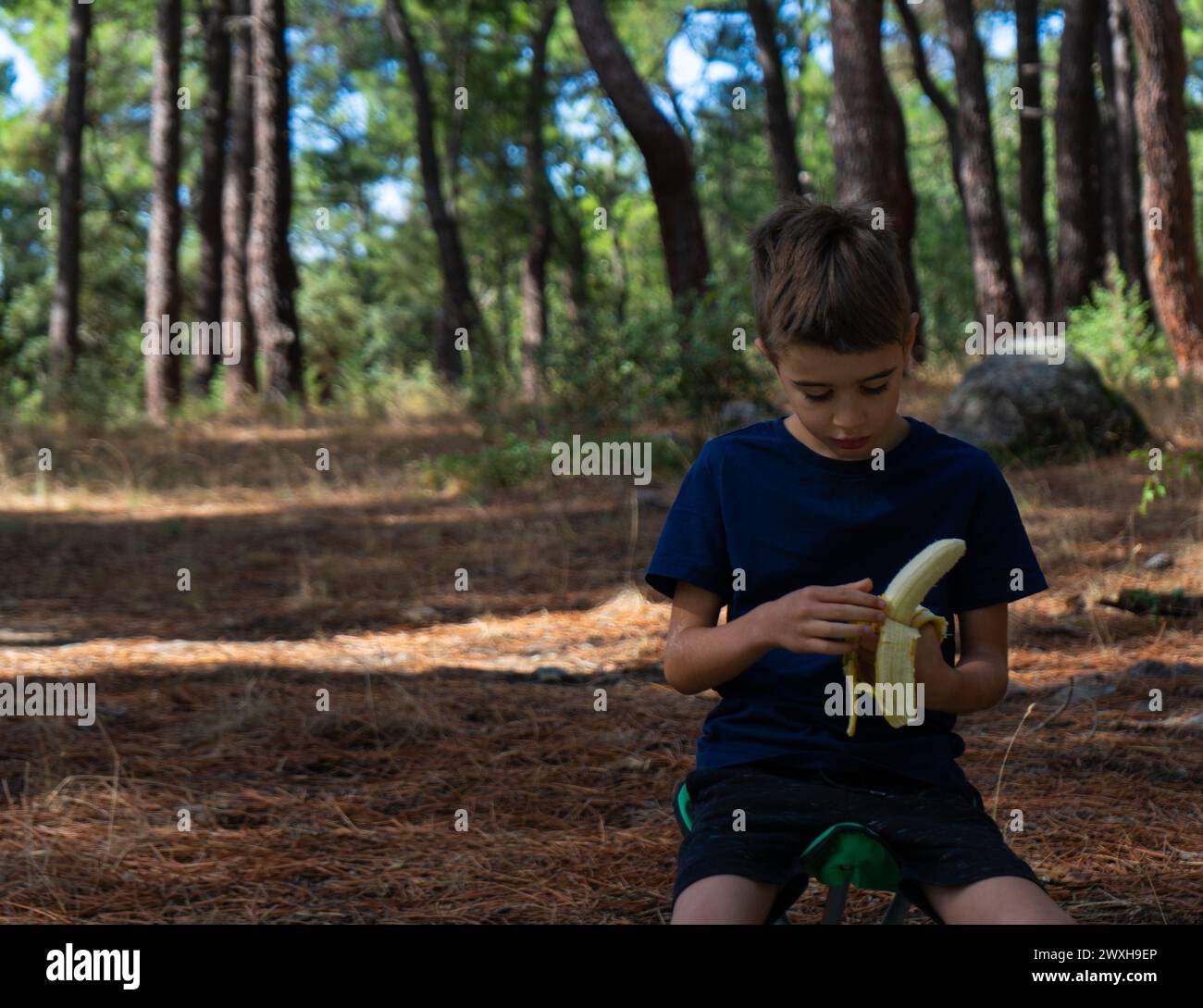 Boy peeling a banana hi-res stock photography and images - Alamy
