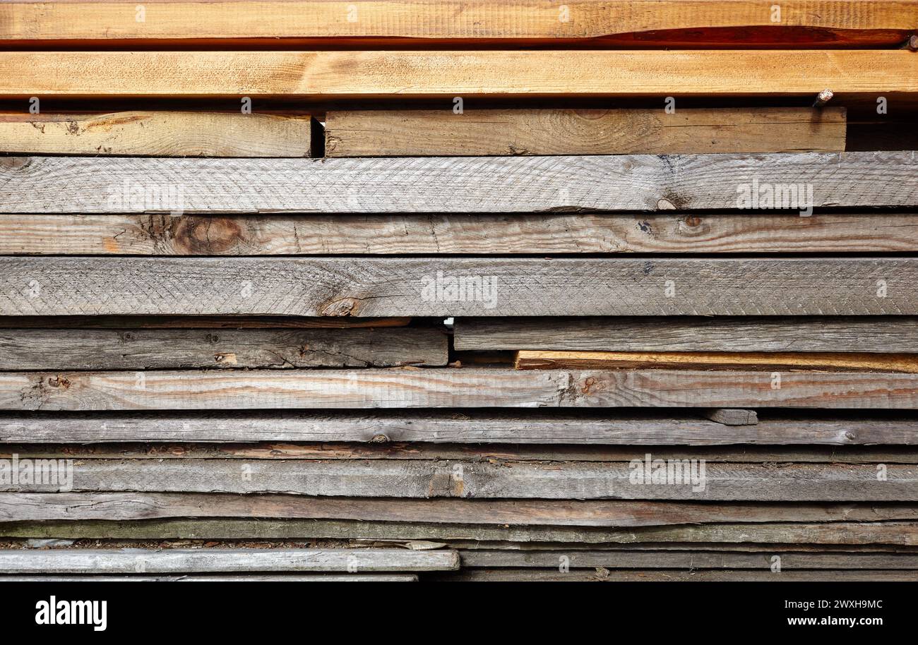 Stack of wooden bars. Wood processing. Stack of pine wood board Stock ...