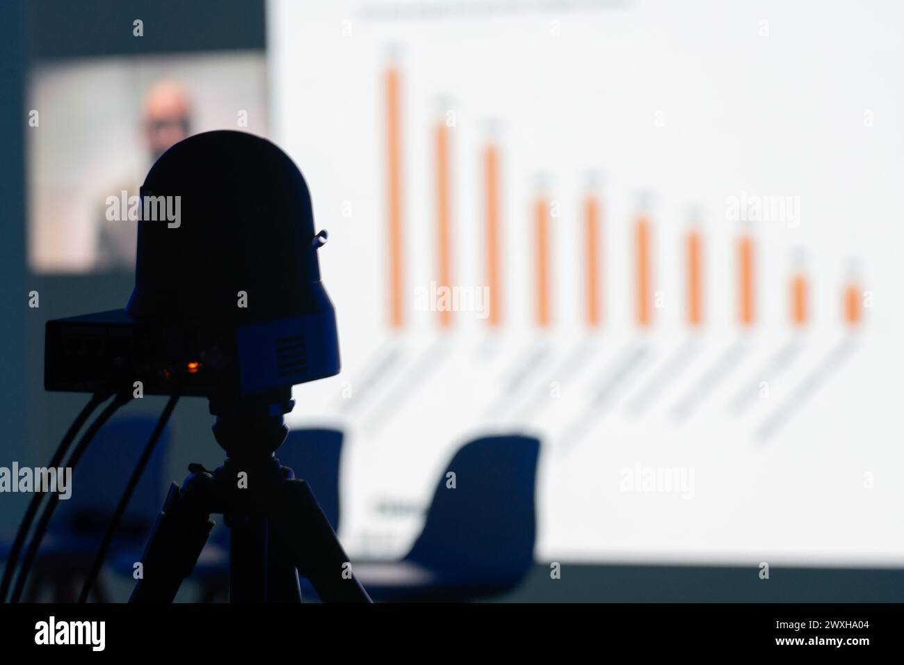 Projection of a graphic on a screen at a company conference, being ...