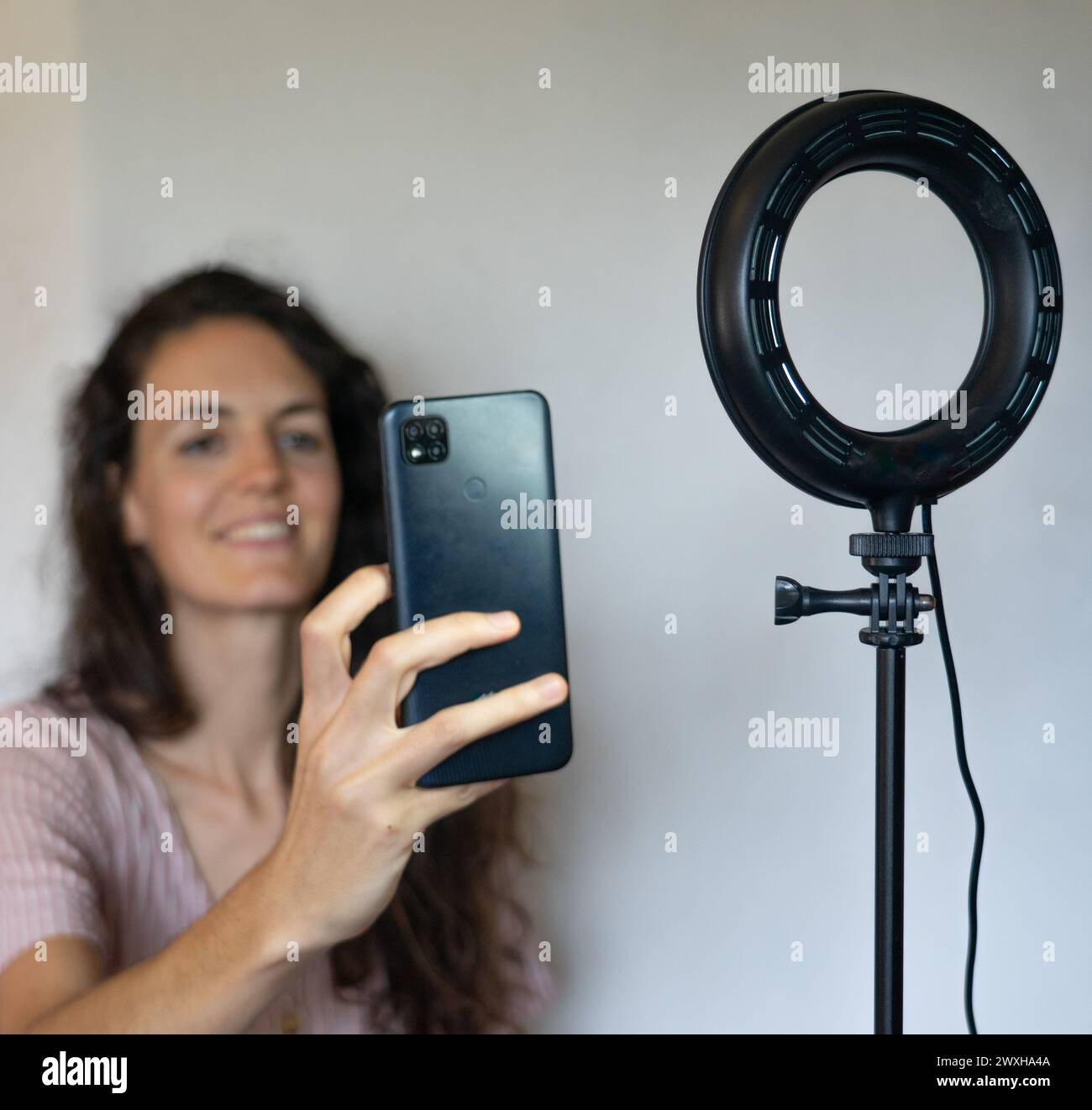 Capturing a Radiant Moment: Girl Recording with Her Mobile Phone Stock ...