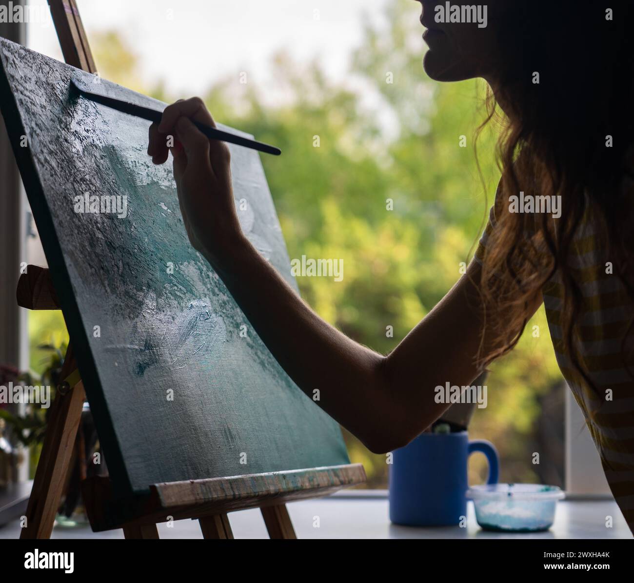 Woman's arm painting abstract art on a canvas Stock Photo - Alamy