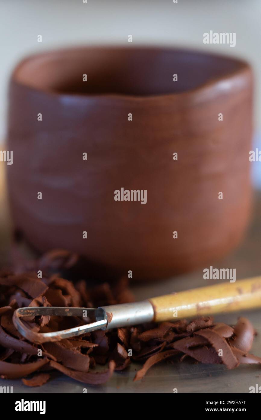 Ceramic vase with clay tools seen up close Stock Photo - Alamy