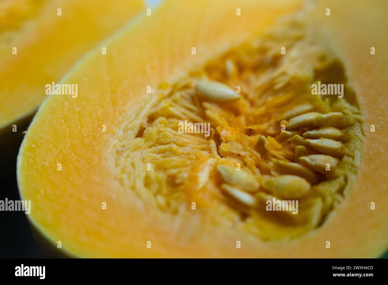 Pumpkin cut in half seen up close Stock Photo - Alamy