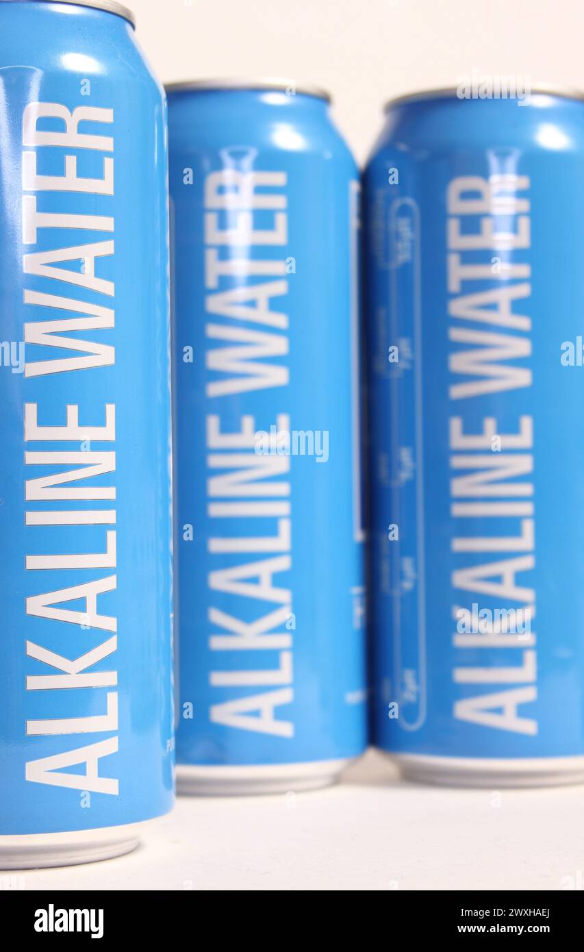 Multiple cans on white counter under light blue sky Stock Photo - Alamy
