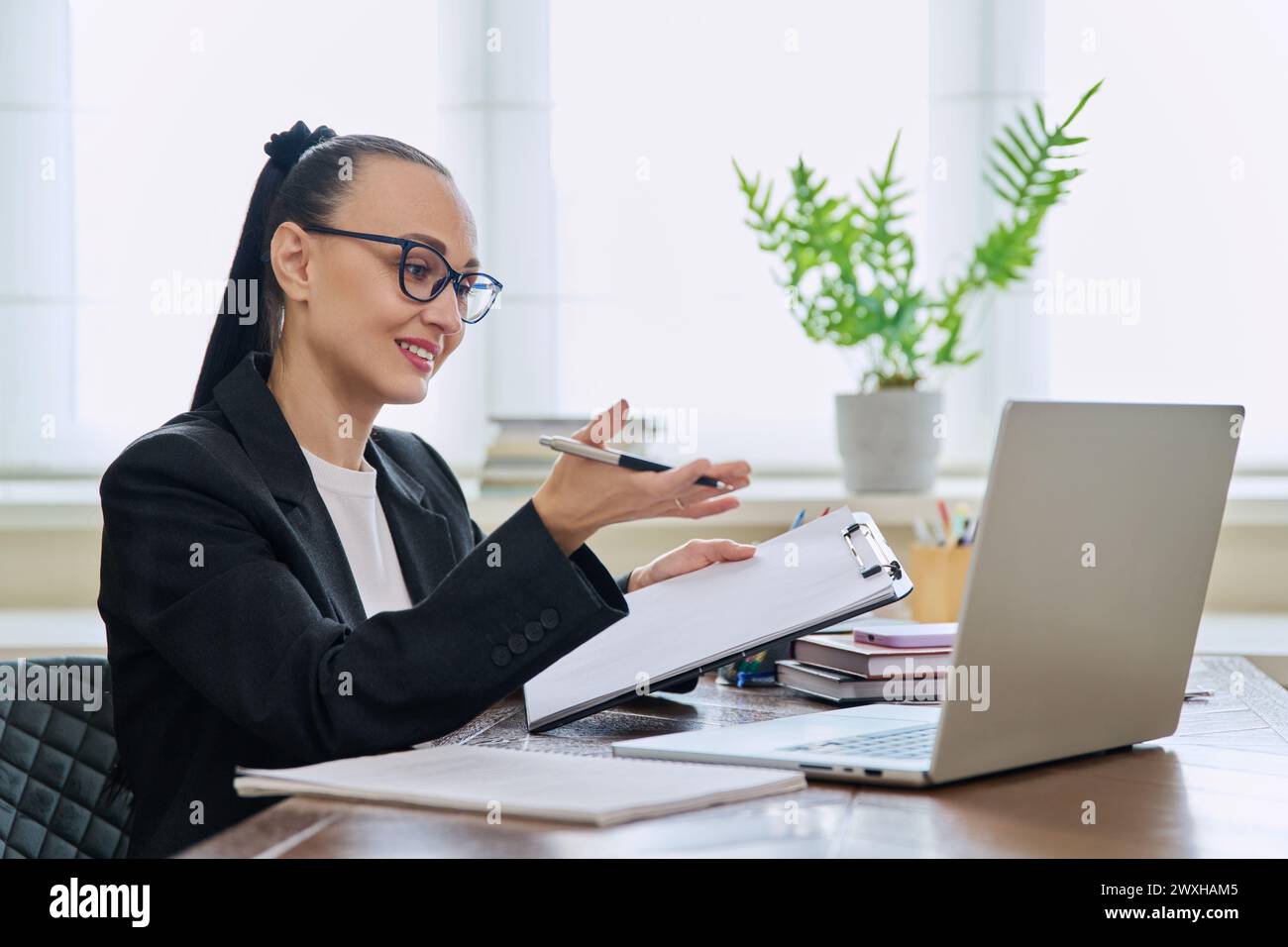 Woman psychologist mental therapist working remotely using computer for ...