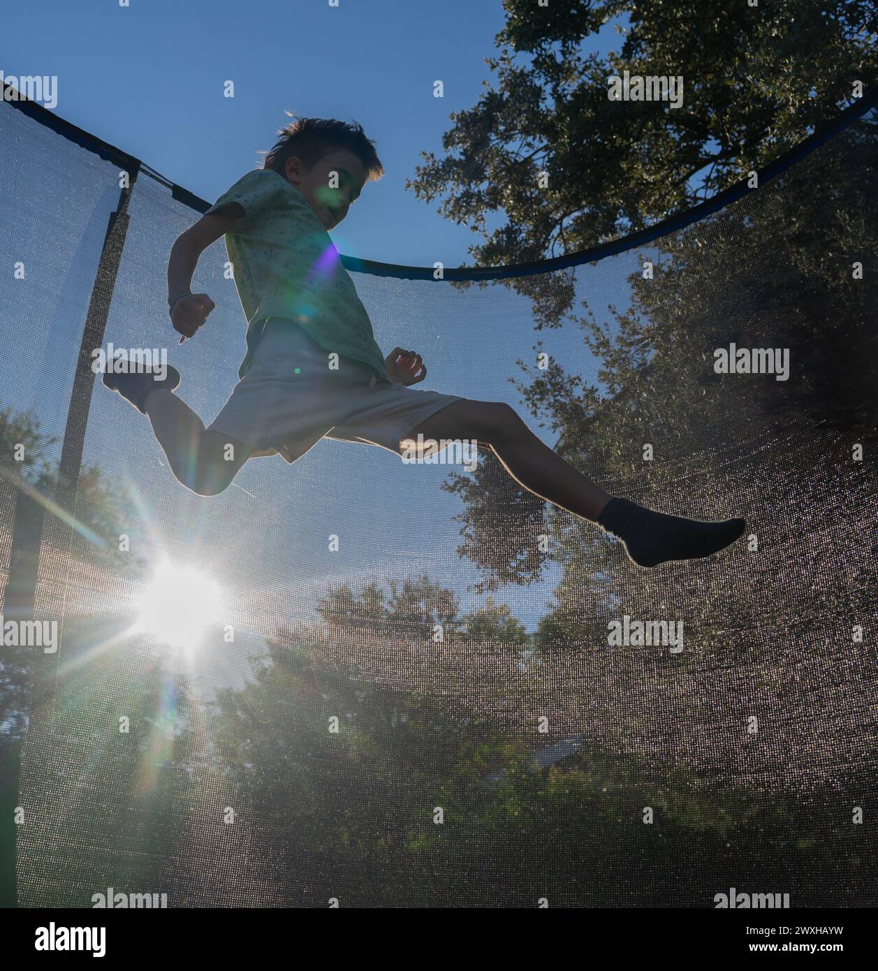 Child jumping high on hi-res stock photography and images - Alamy