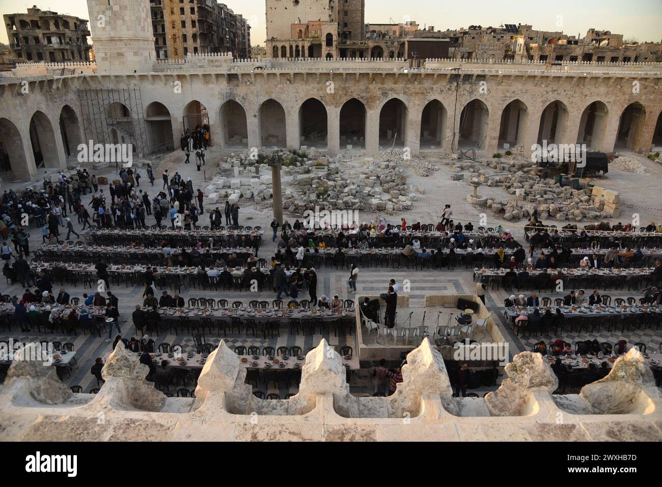 Aleppo, Syria. 30th Mar, 2024. People attend an iftar banquet at the ...