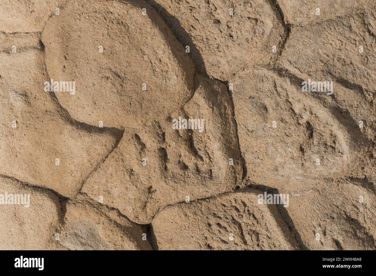 Close-up beige color stone rough solid texture pattern abstract wall ...
