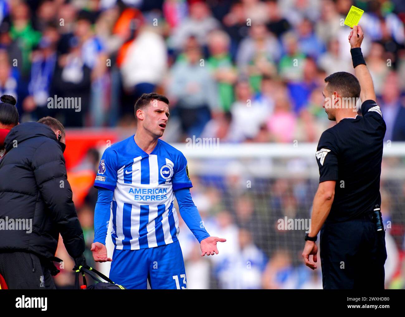 Brighton and Hove Albion's Pascal Gross is shown a yellow card after ...