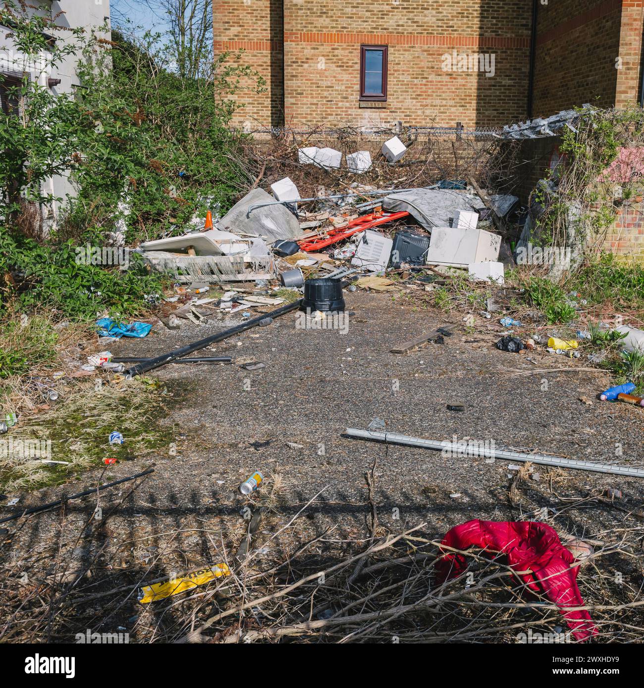 Dumped Rubbish on waist ground Stock Photo - Alamy