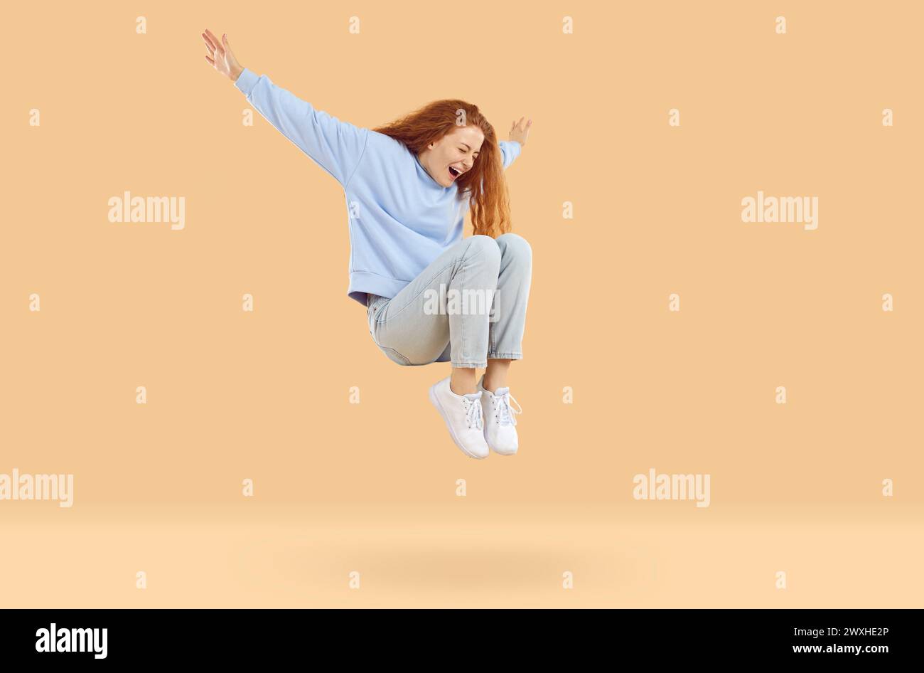 Happy excited teenage girl is happy jumping high and levitating on ...
