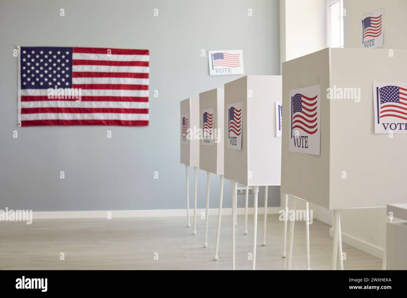 Side view of white empty voting booths at polling station with American ...