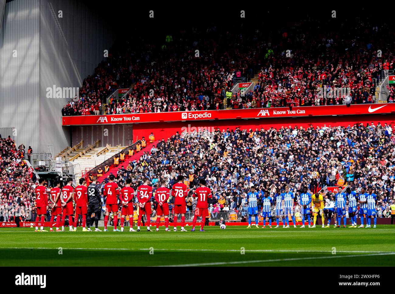 Players and fans observe a minute's silence in memory of former ...