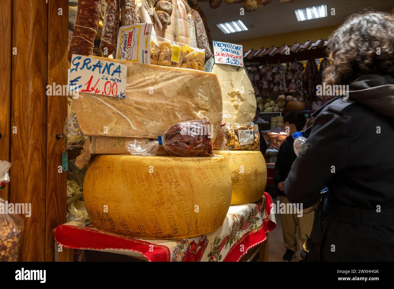 Italian cheese displayed at entrance of food shop in Naples, Ai Monti ...
