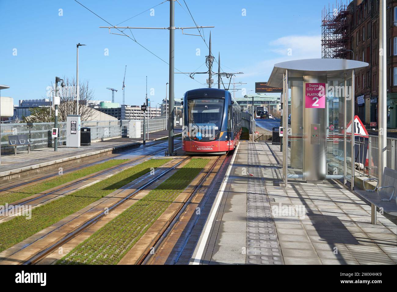 Tram approaching a platform in Newhaven, Edinburgh, Scotland Stock ...