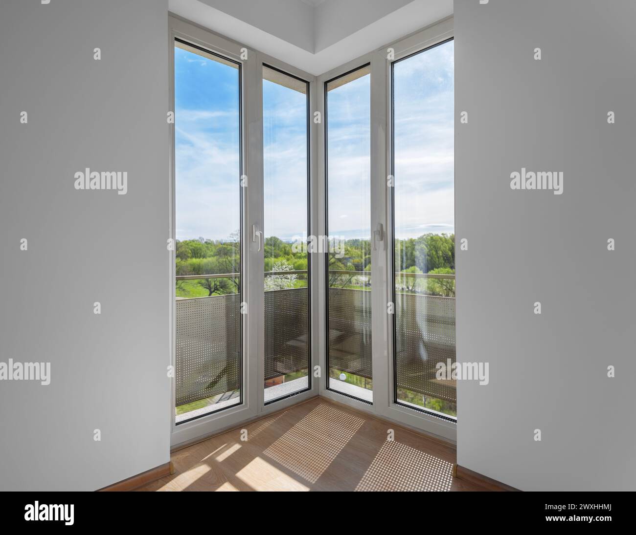 Corner window to the floor in the living room Stock Photo - Alamy