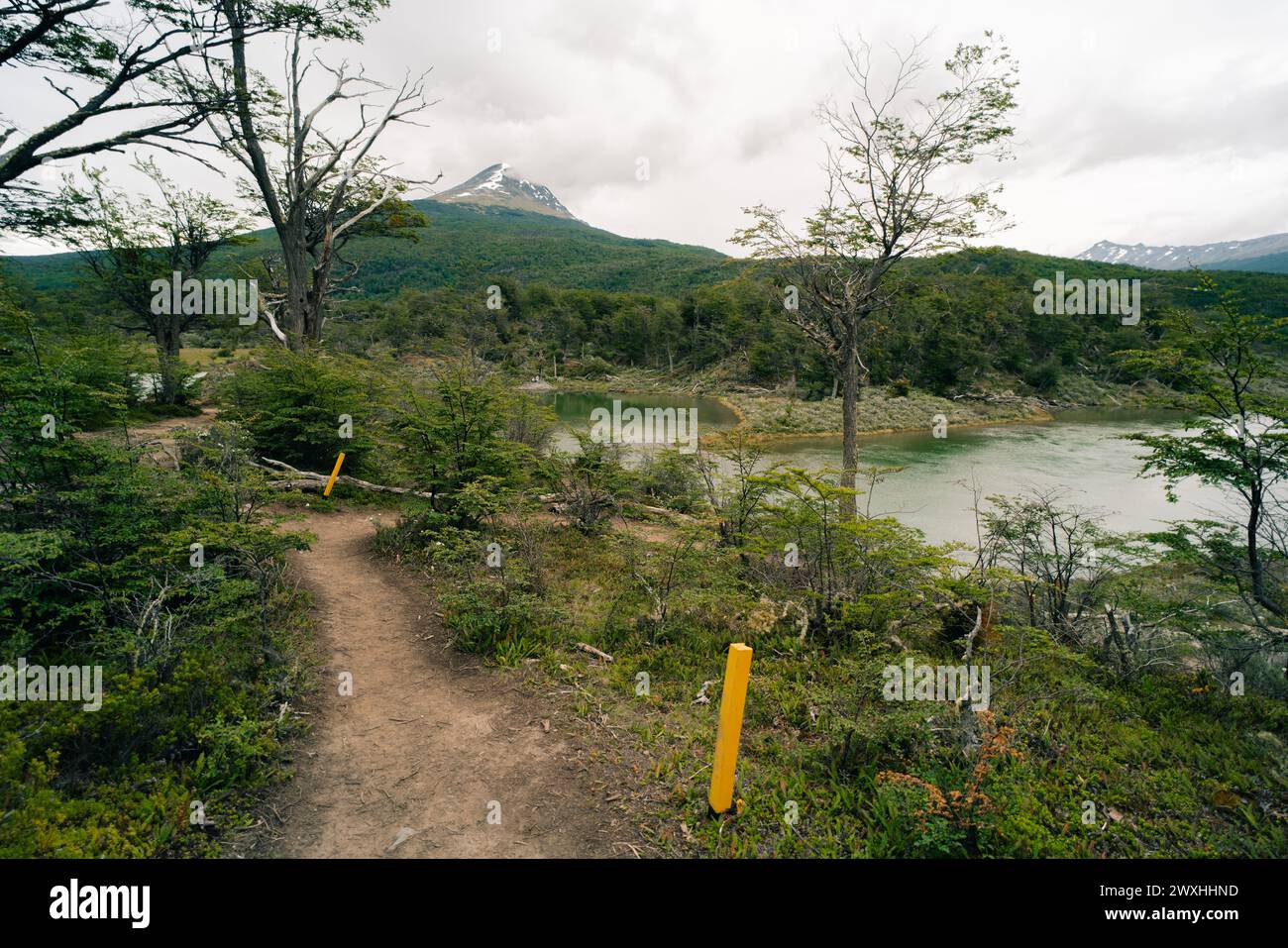 lake in Bahia Lapataia amidst mountains at Tierra del Fuego. High ...