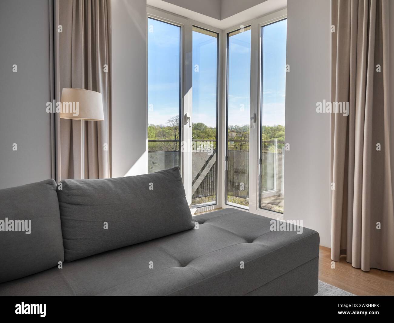 Corner window to the floor in the living room Stock Photo - Alamy