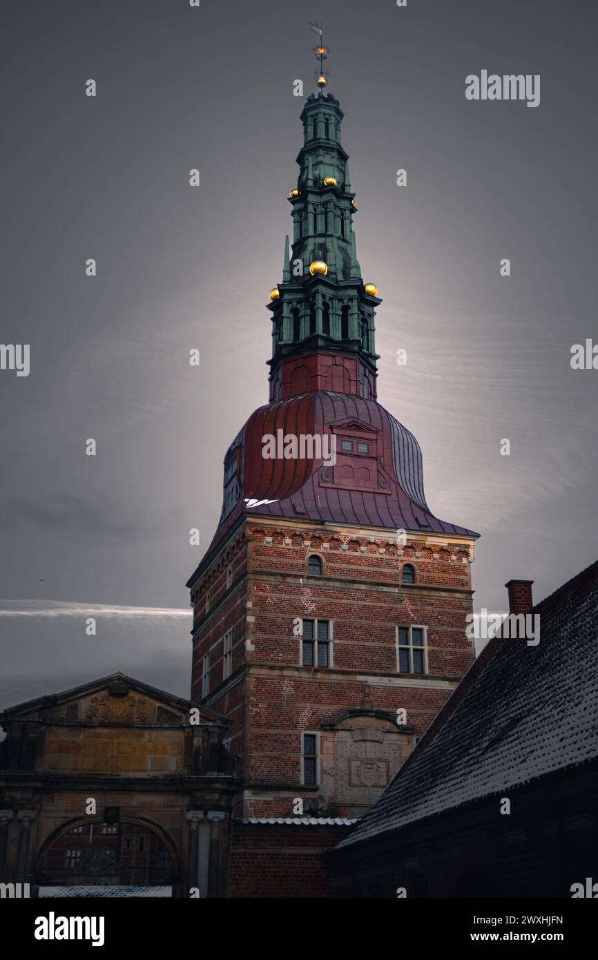 A tall tower glowing in the sunset light Stock Photo - Alamy
