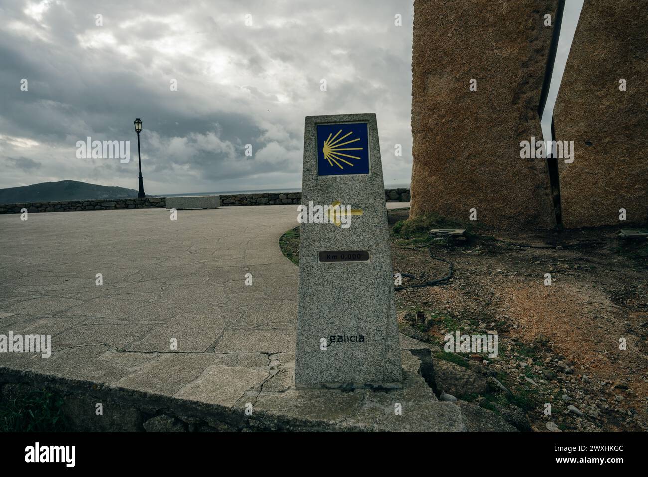 Way Marking Stone Post with Scallop Shell Symbol and Yellow Arrow Sign ...