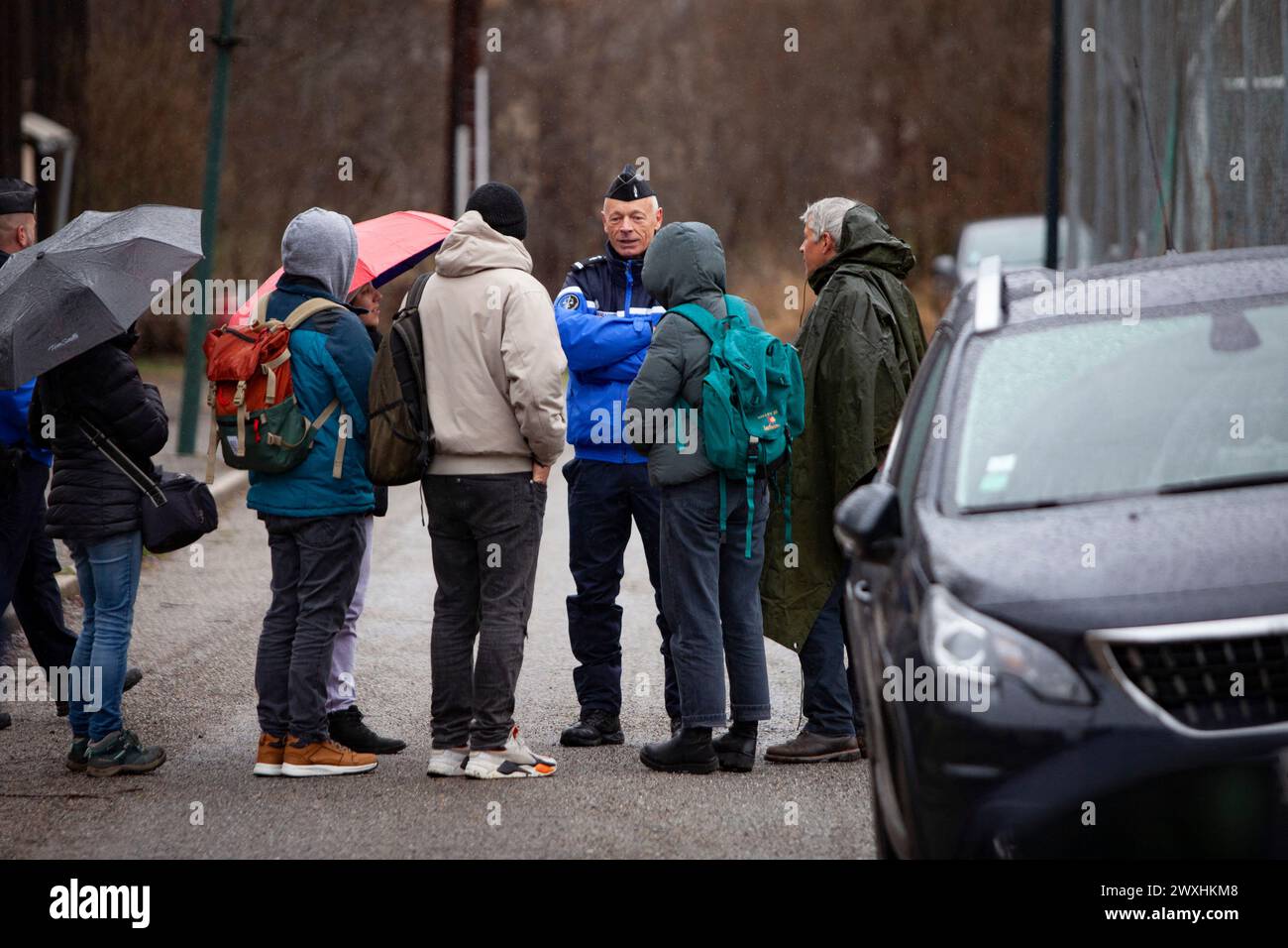 Vernet, France. 28th Mar, 2024. A gendarme answers questions from ...