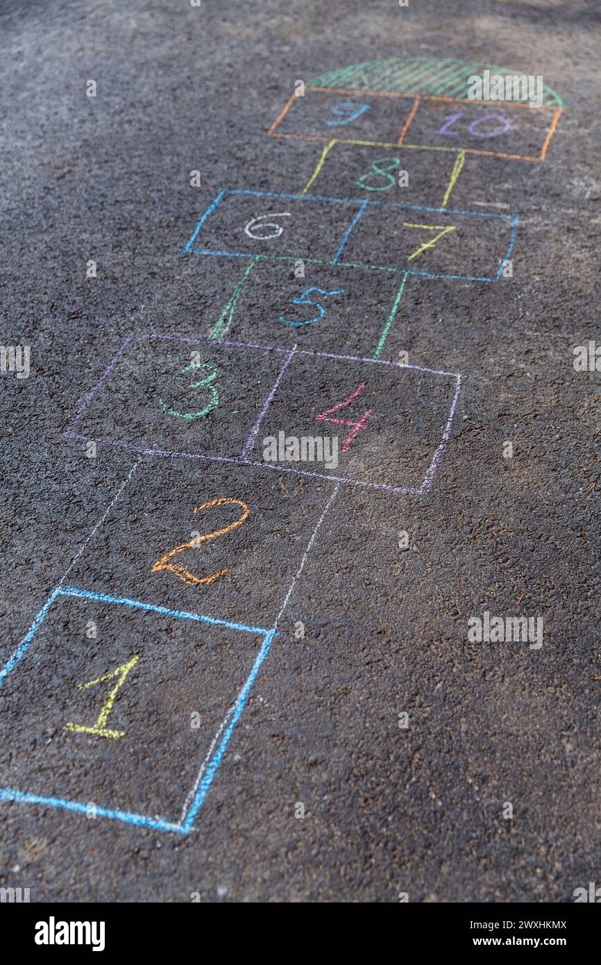 hopscotch chalk drawing on asphalt pavement Stock Photo - Alamy