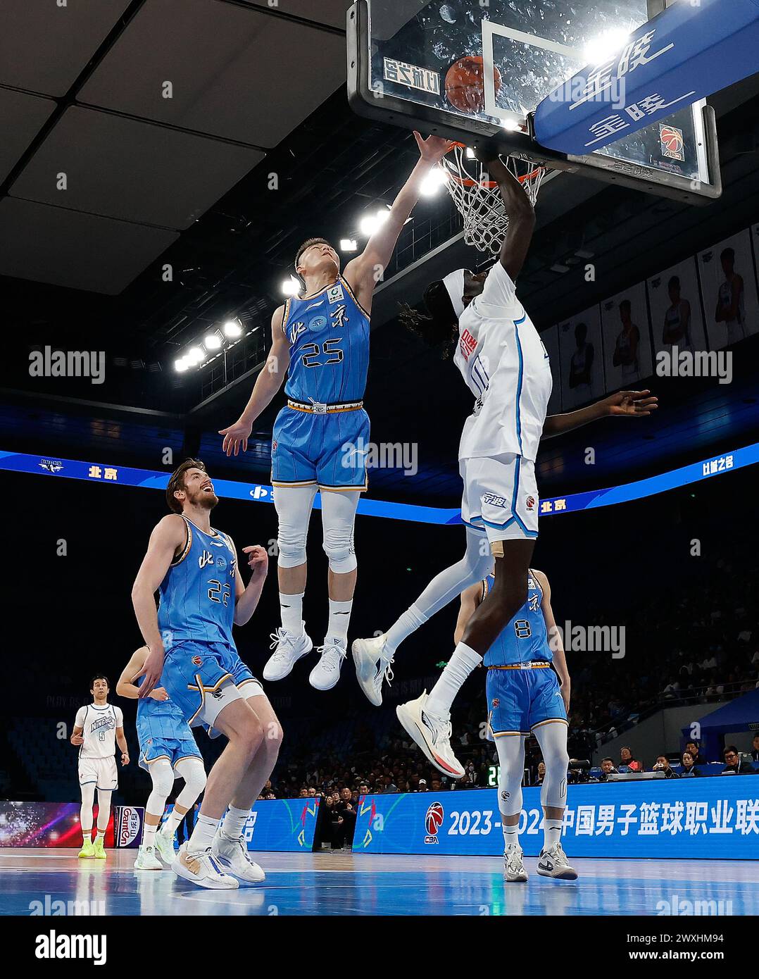 Beijing, China. 31st Mar, 2024. Anunwa Omot (Top R) of Ningbo Rockets ...