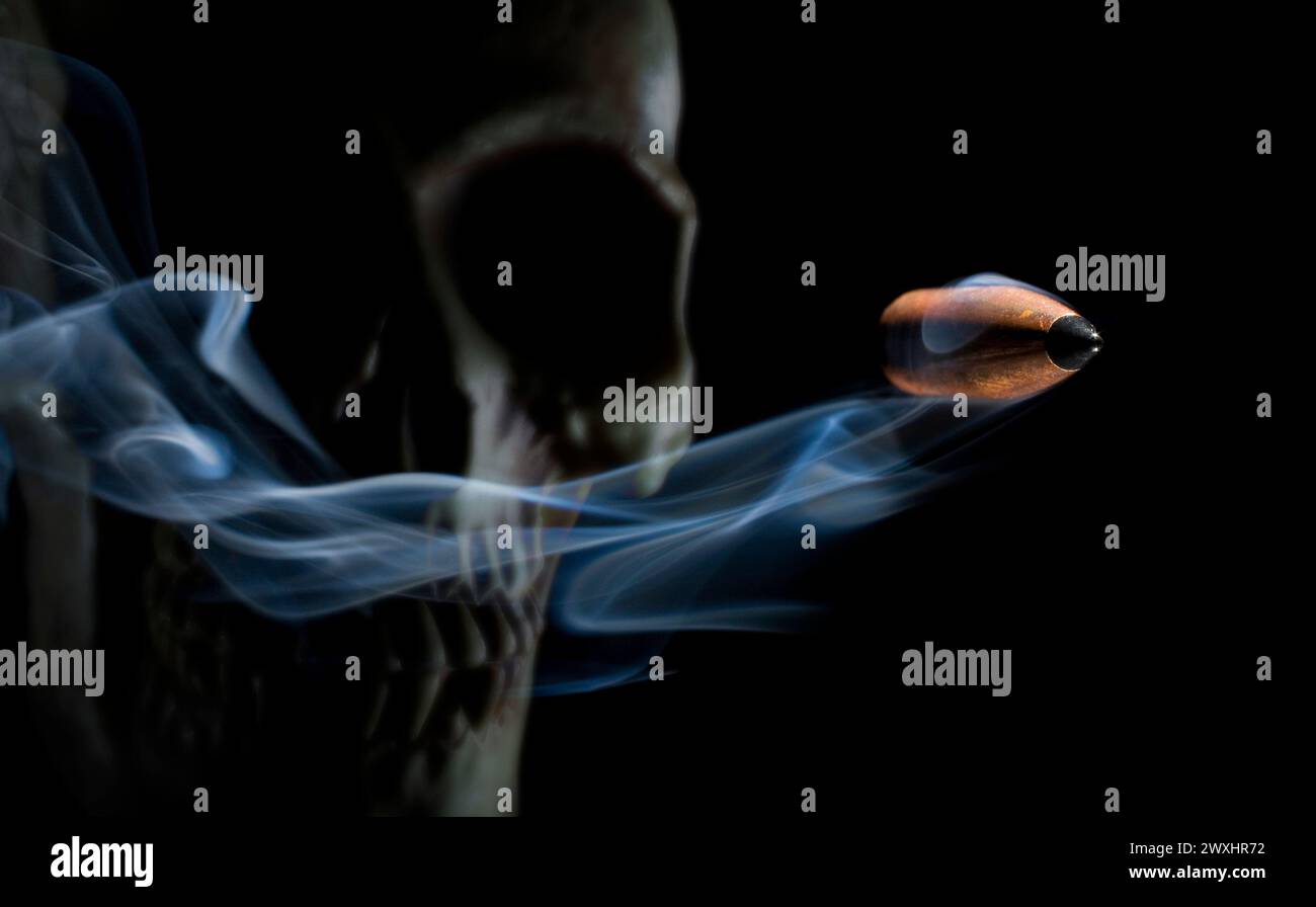 Fatal copper plated bullet with smoke behind coming from a skull Stock ...