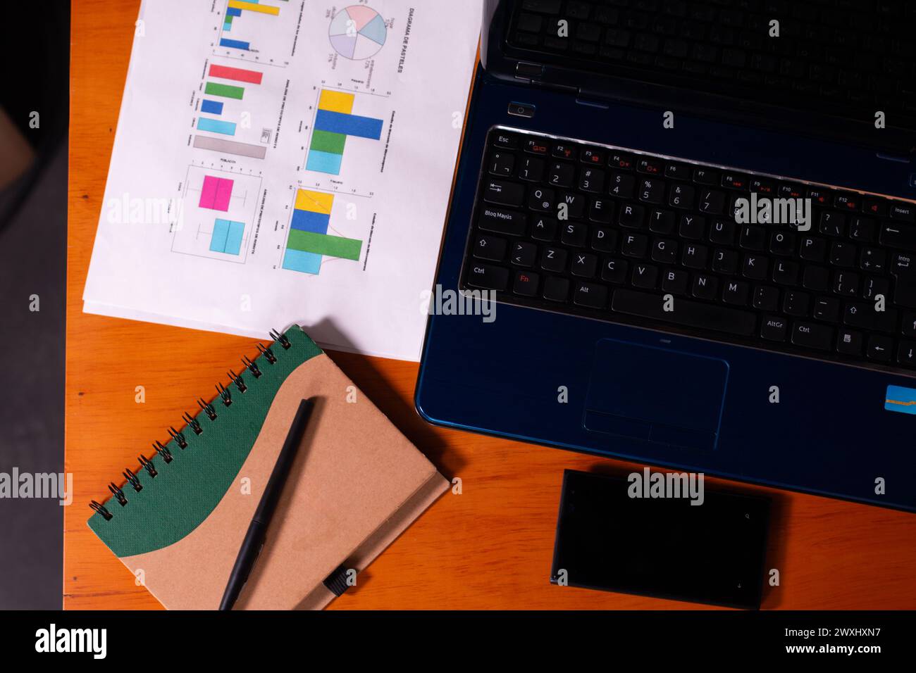 office desk with digital view, laptop, diagram, notepad, and smartphone ...