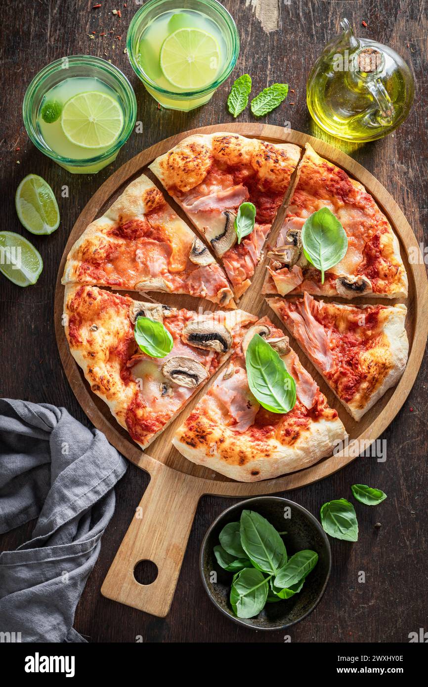 Spicy Capricciosa pizza with cheese, mushrooms and ham. Classic Italian ...