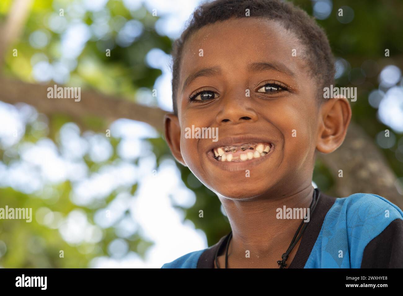 INDONESIA, ISLAND KRI - JANUARY 27, 2024: Papuan boy with shiny eyes ...