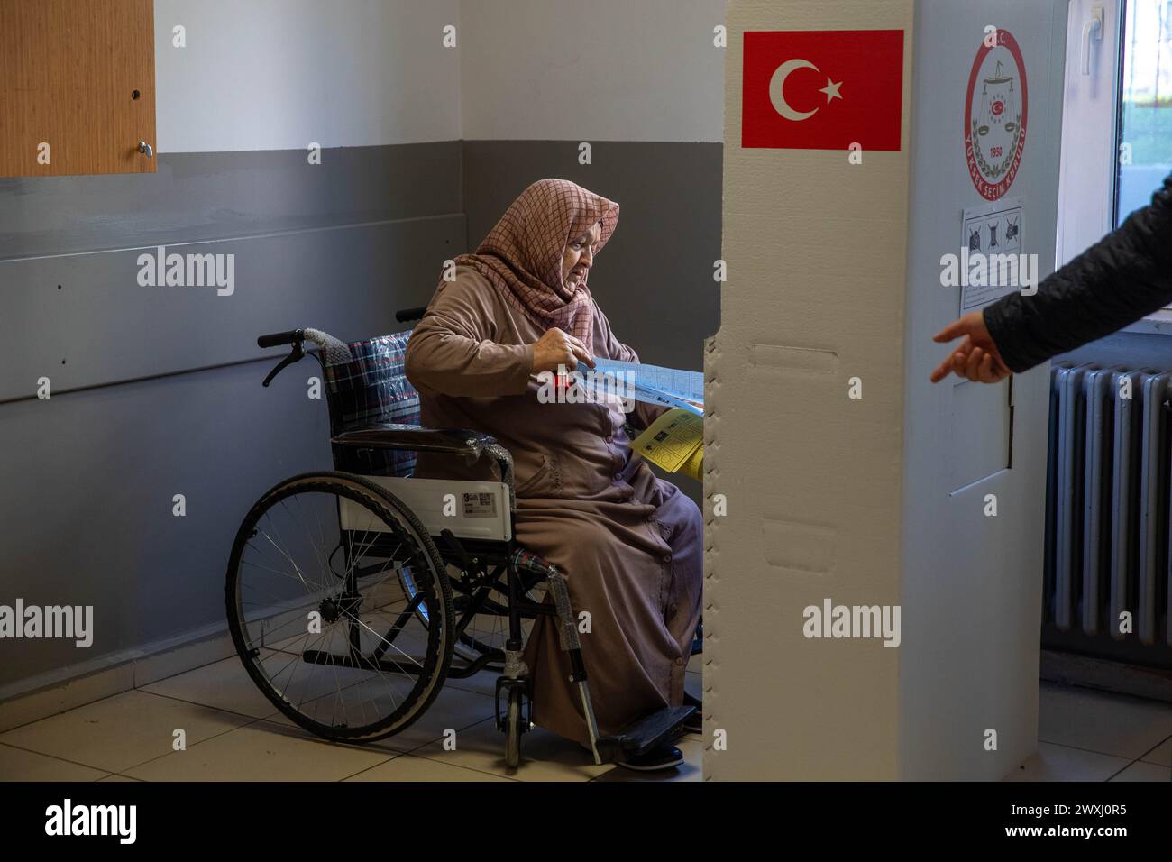 March 31, 2024: Istanbul, Turkey: A woman in a wheelchair voting in ...