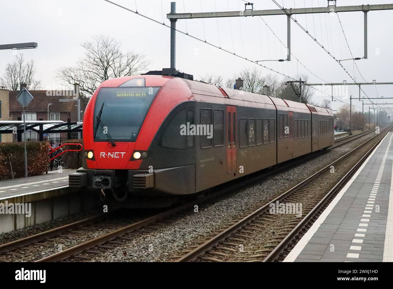 Red and black Stadler GTW train of R-Net at station Hardinxveld ...