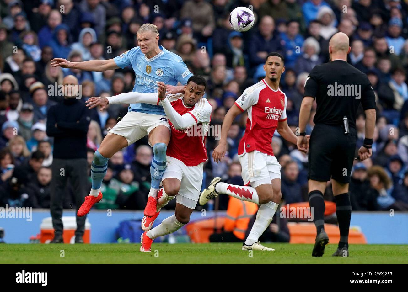 Manchester City's Erling Haaland battles for the ball against Arsenal's ...