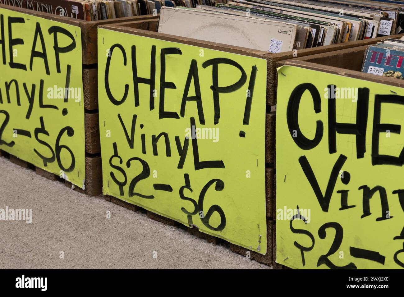 Noblesville - March 28, 2024: Box of cheap LP record albums at an ...