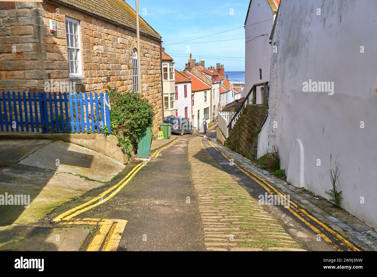 Narrow village street scene in Staithes, Yorkshire, UK Stock Photo - Alamy