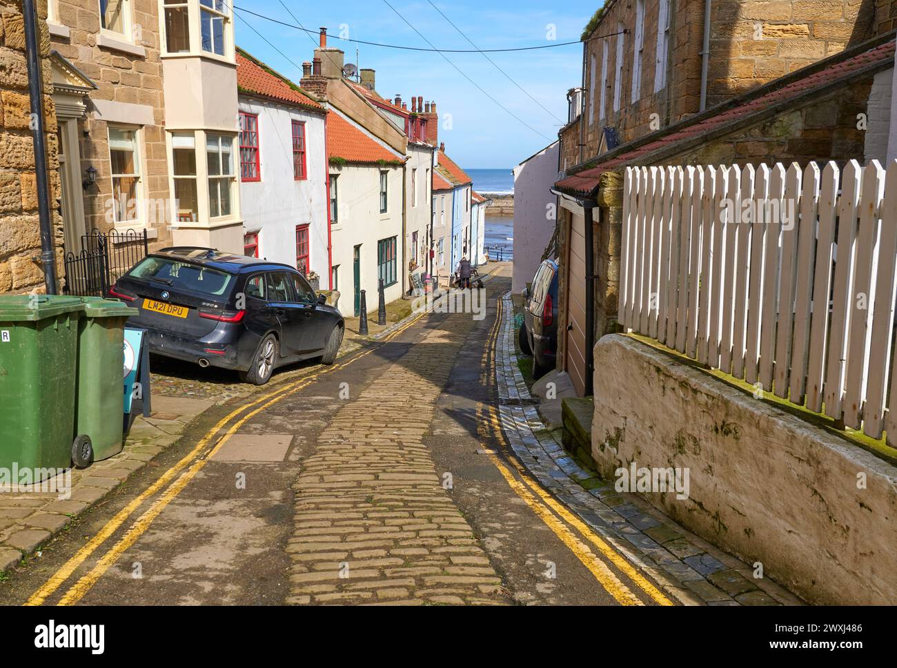 Narrow village street scene in Staithes, Yorkshire, UK Stock Photo - Alamy