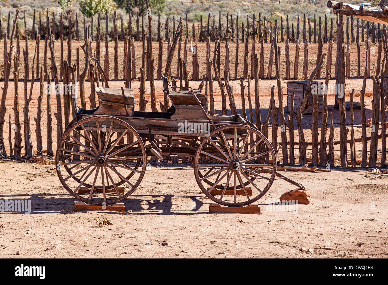 The frame and wheels of an old wagon displayed in the desert of the ...