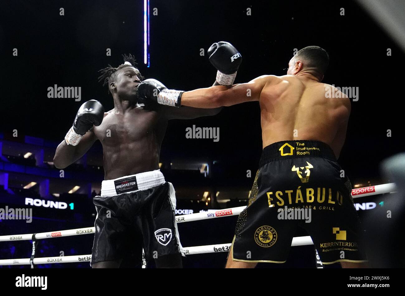 Callum Simpson (right) and Dulla Mbabe during their super middle weight ...