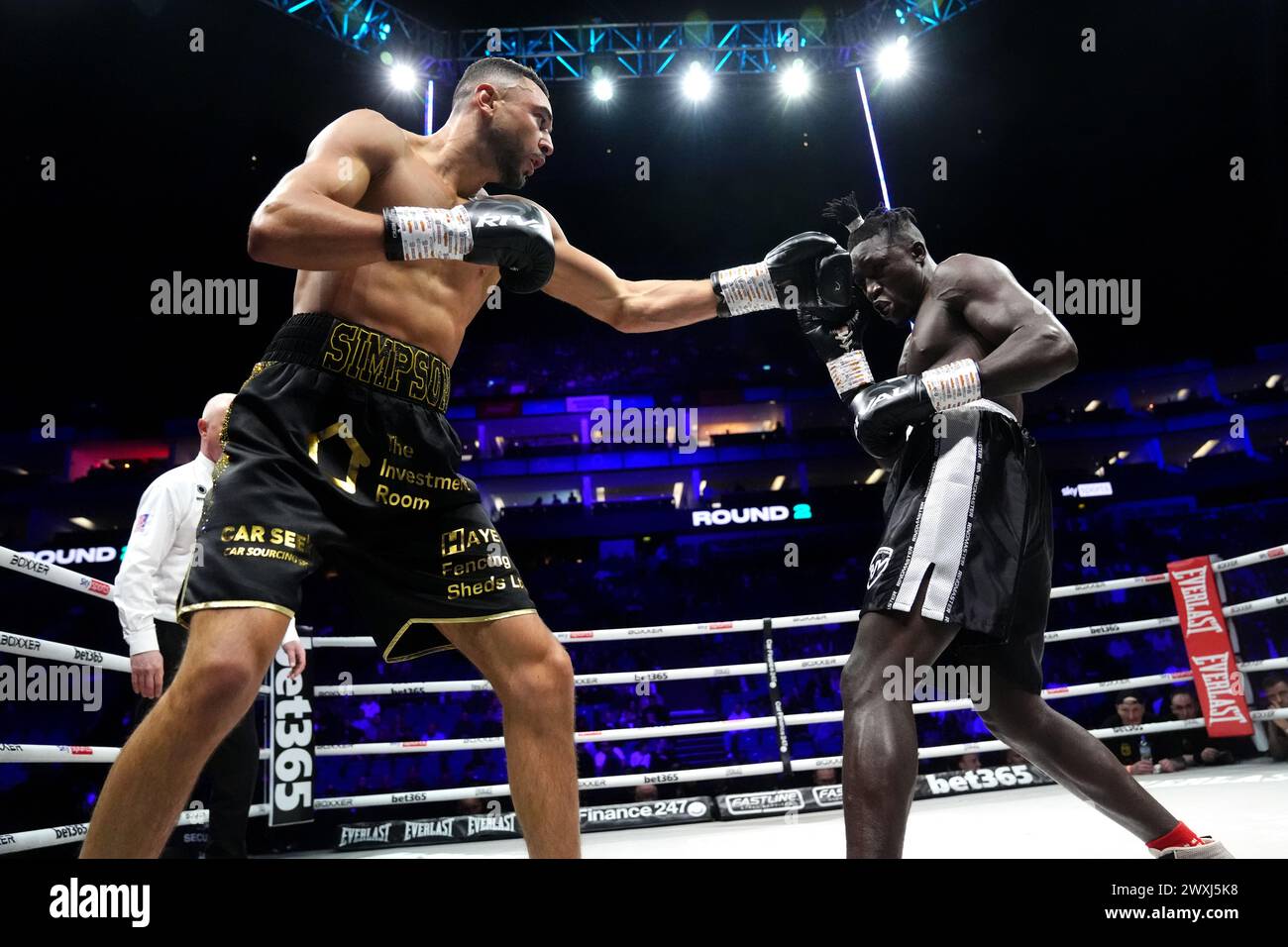 Callum Simpson (left) and Dulla Mbabe during their super middle weight ...