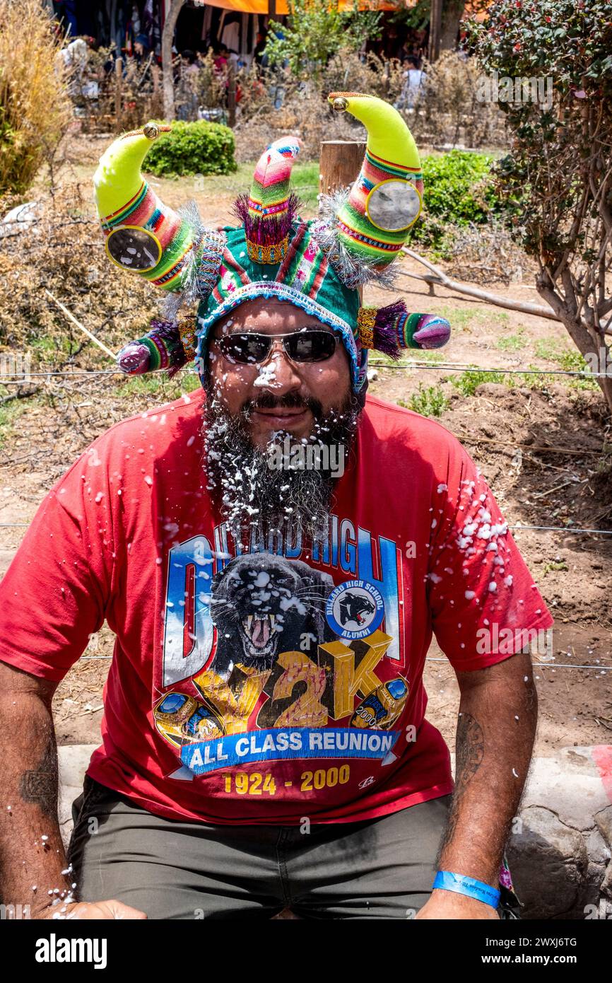 A Carnival Reveller Wearing A Traditional Devil Hat Sitting Down ...