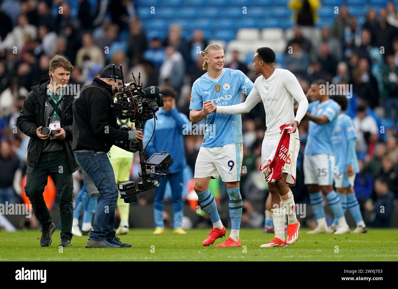 Manchester City Erling Haaland speaks with Arsenal's Gabriel following ...