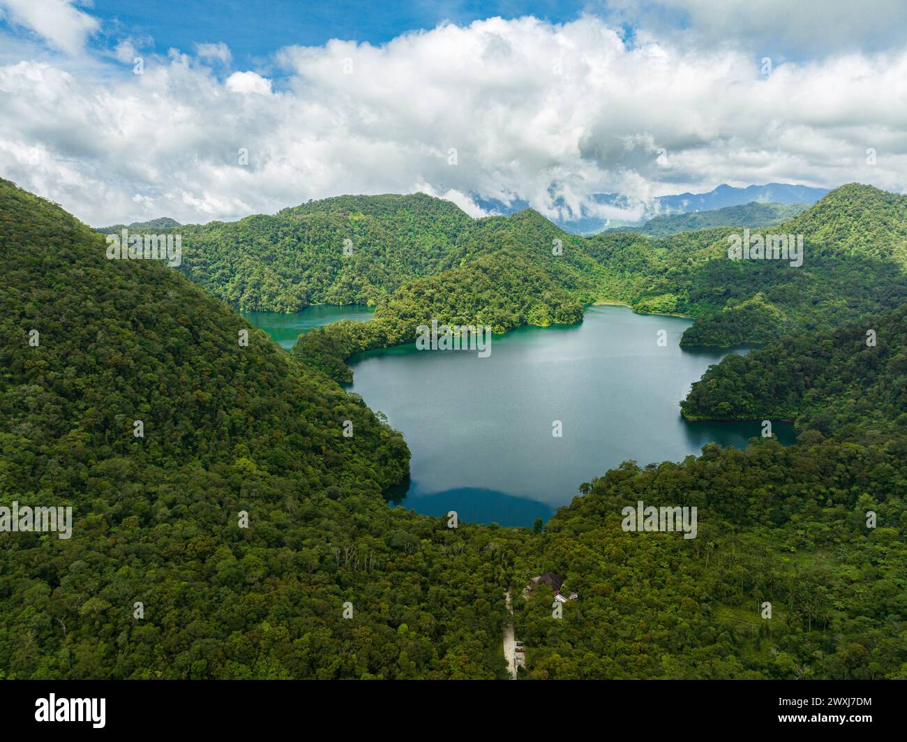 Lake in the mountains among tropical vegetation view from above ...