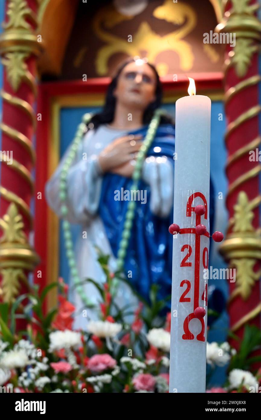 NOIDA, INDIA - MARCH 31: Priest leads prayers on the occasion of Easter ...